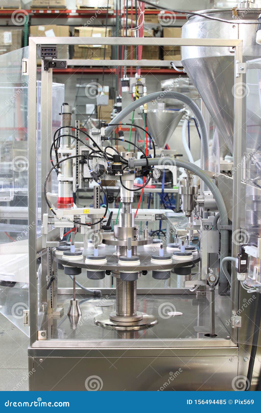 Machinery Filling Glass Vials in a Cosmetics Factory. Stock Image ...