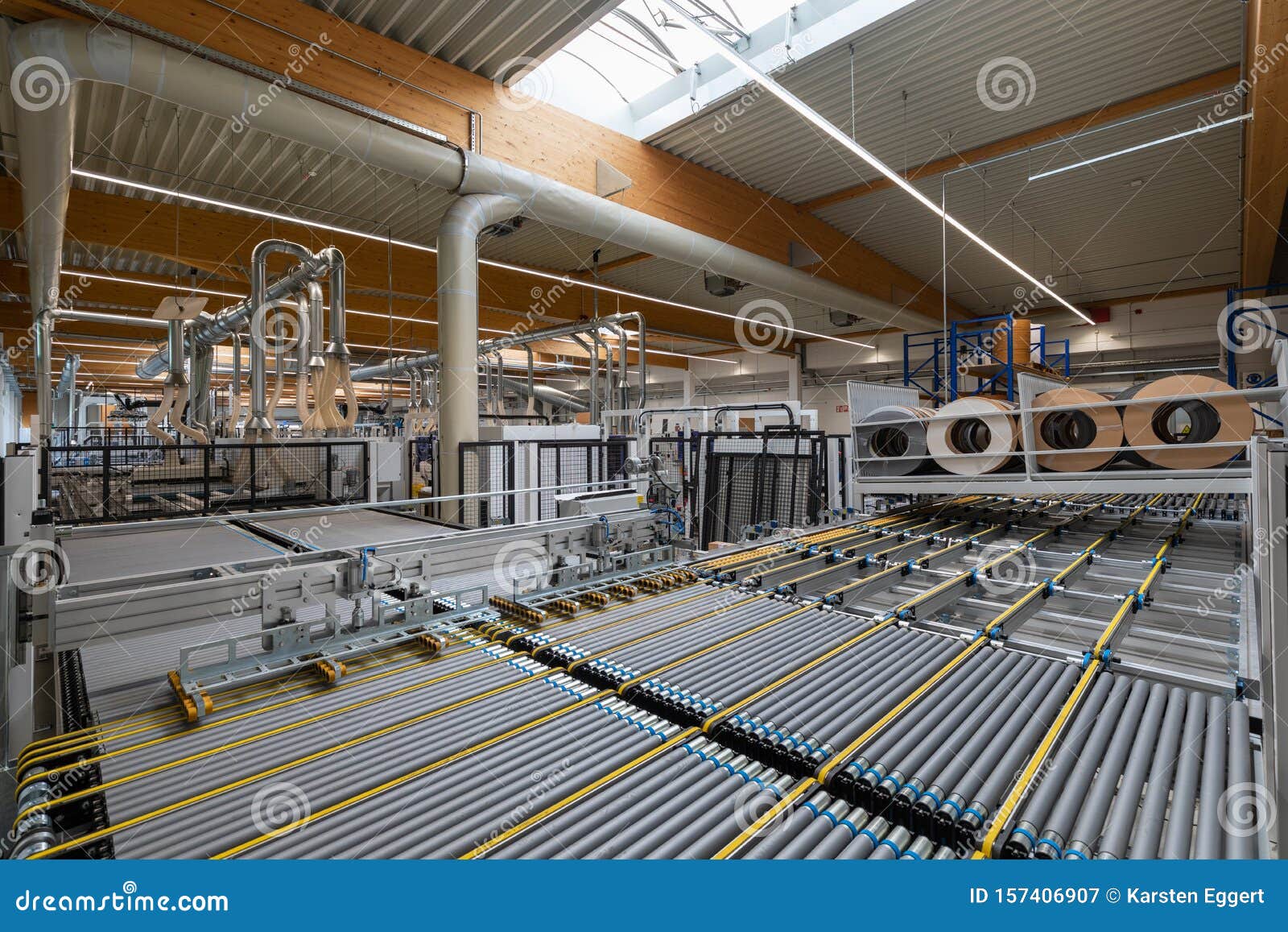 A Factory Hall There is a Gigantic Machine that Uses Rollers for ...