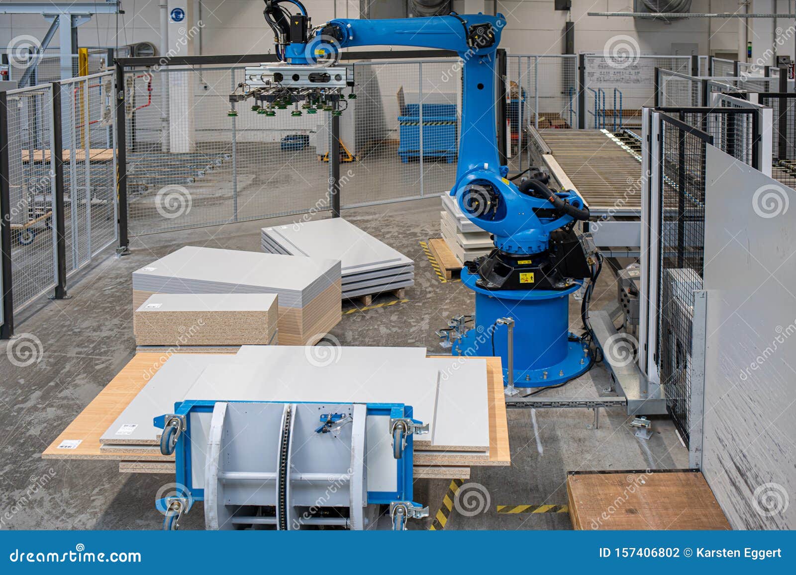 A Factory Hall There is a Gigantic Machine Which is Equipped by a Robot ...