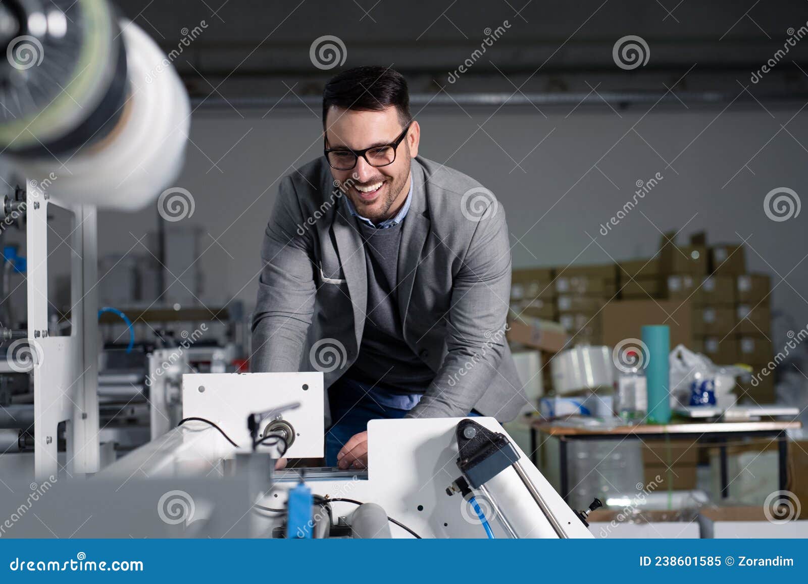 Factory Young Manager in Inspection of Manufacturing. Man in Industrial ...