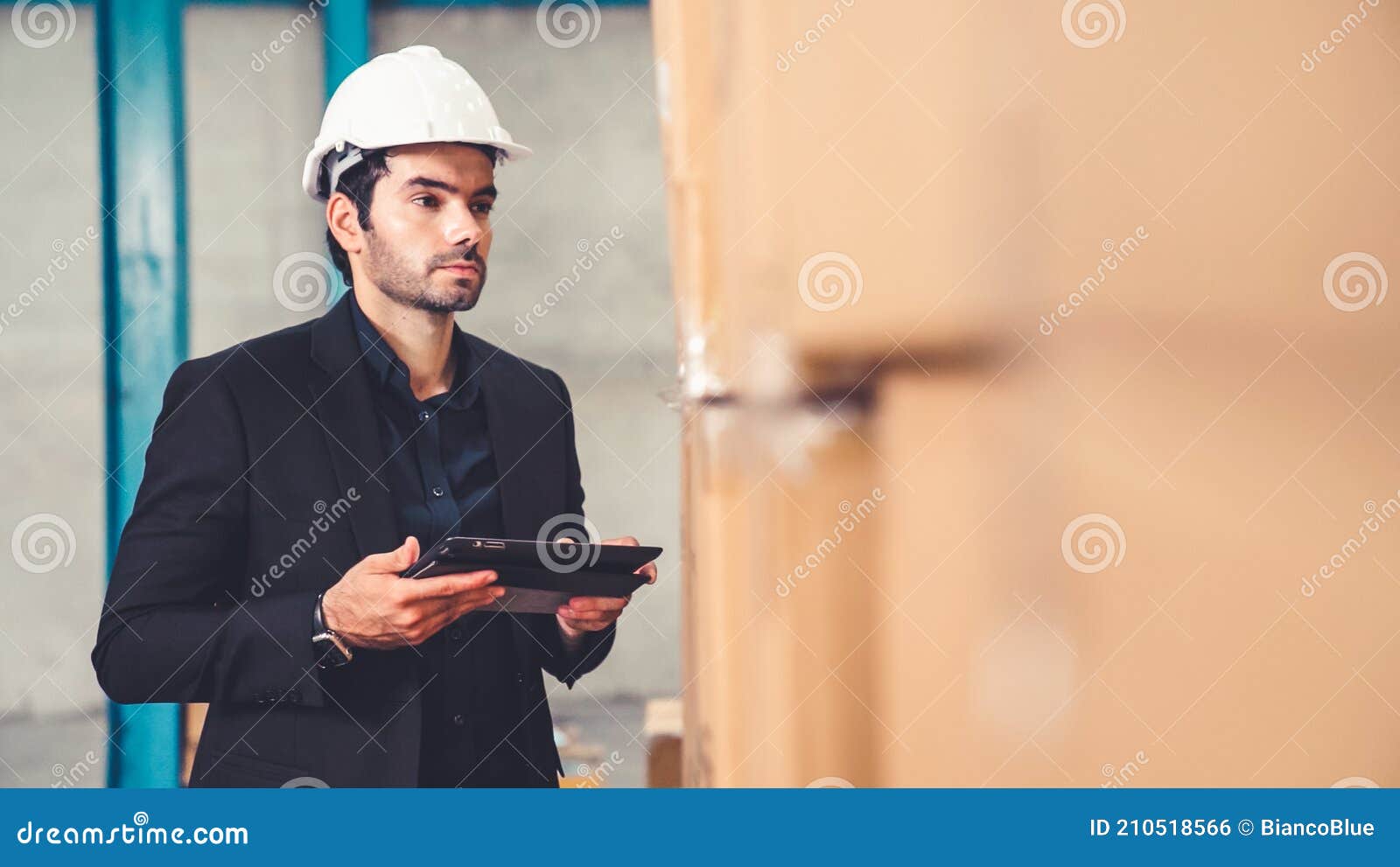 Factory Manager Using Tablet Computer in Warehouse or Factory Stock ...