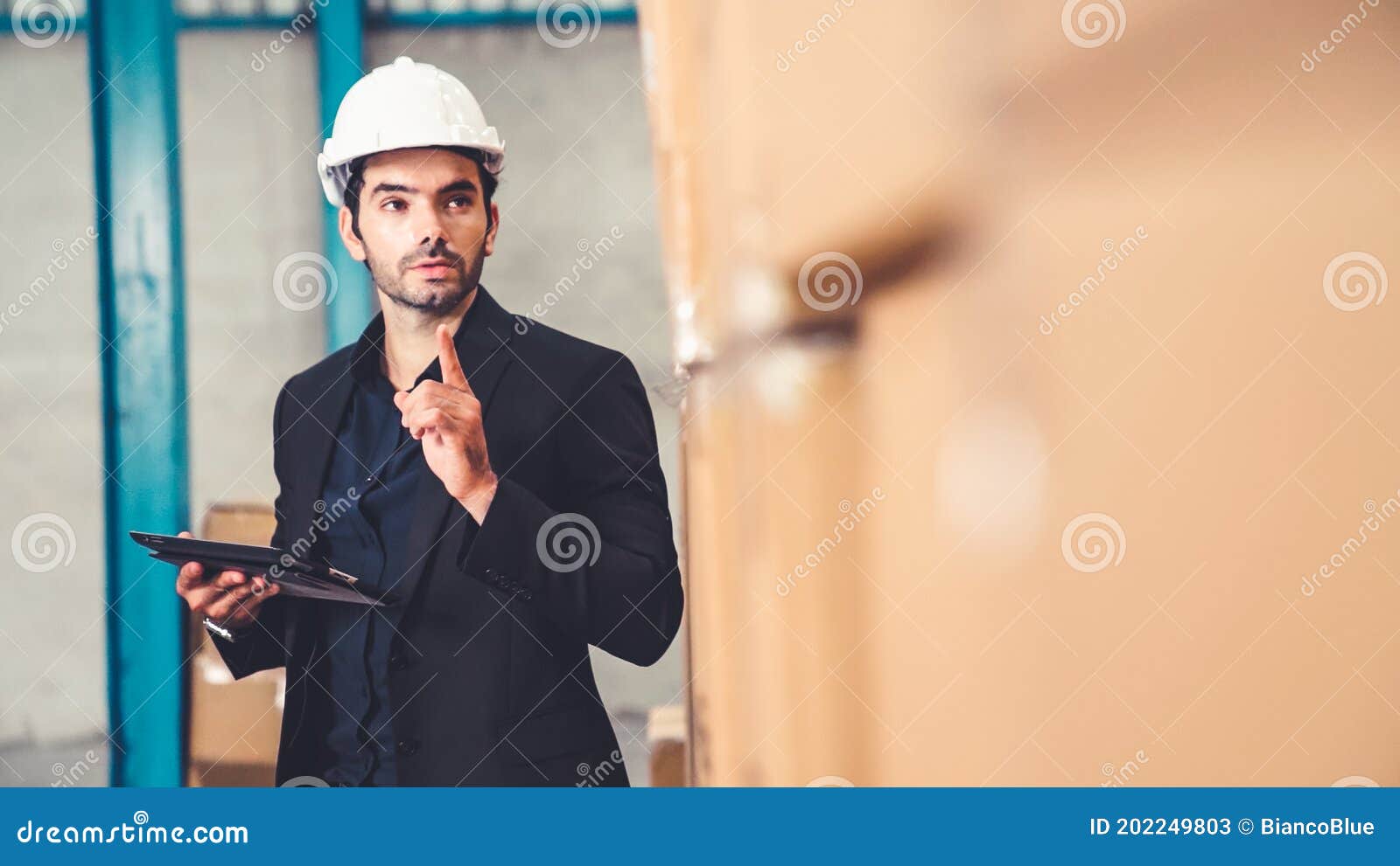 Factory Manager Using Tablet Computer in Warehouse or Factory Stock ...