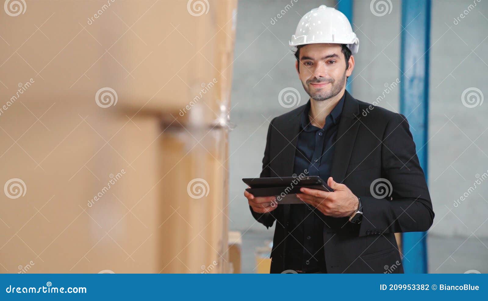 Factory Manager Using Tablet Computer in Warehouse or Factory Stock ...