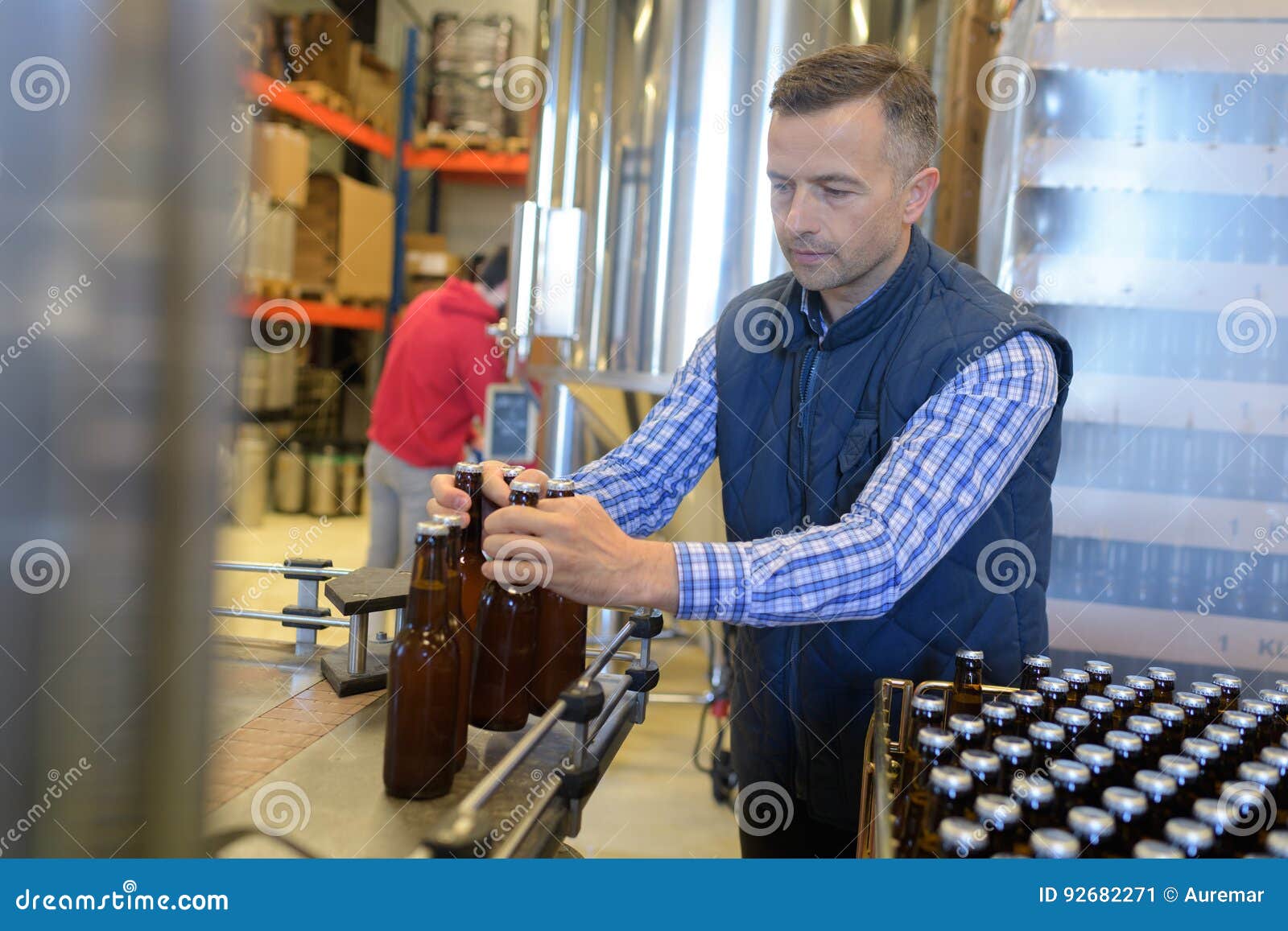Factory Operative Packing Bottles From End Production Line Stock Image ...