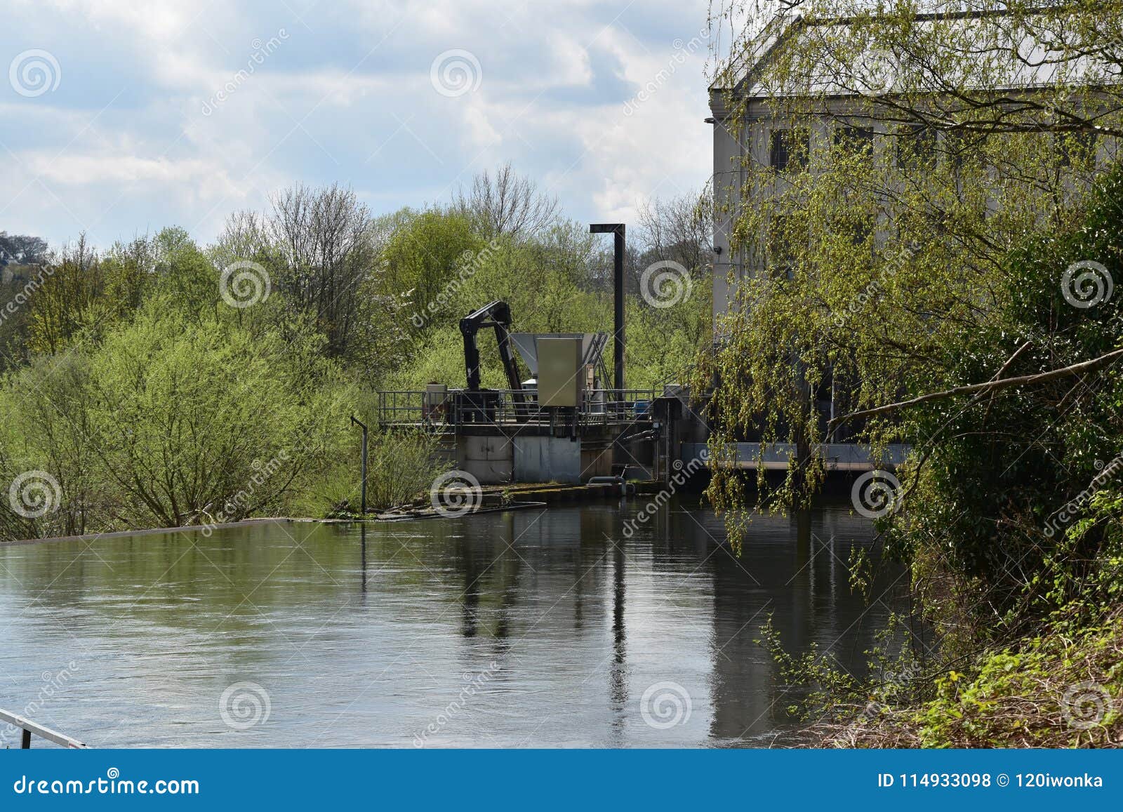 Factory by the river stock photo. Image of industry - 114933098