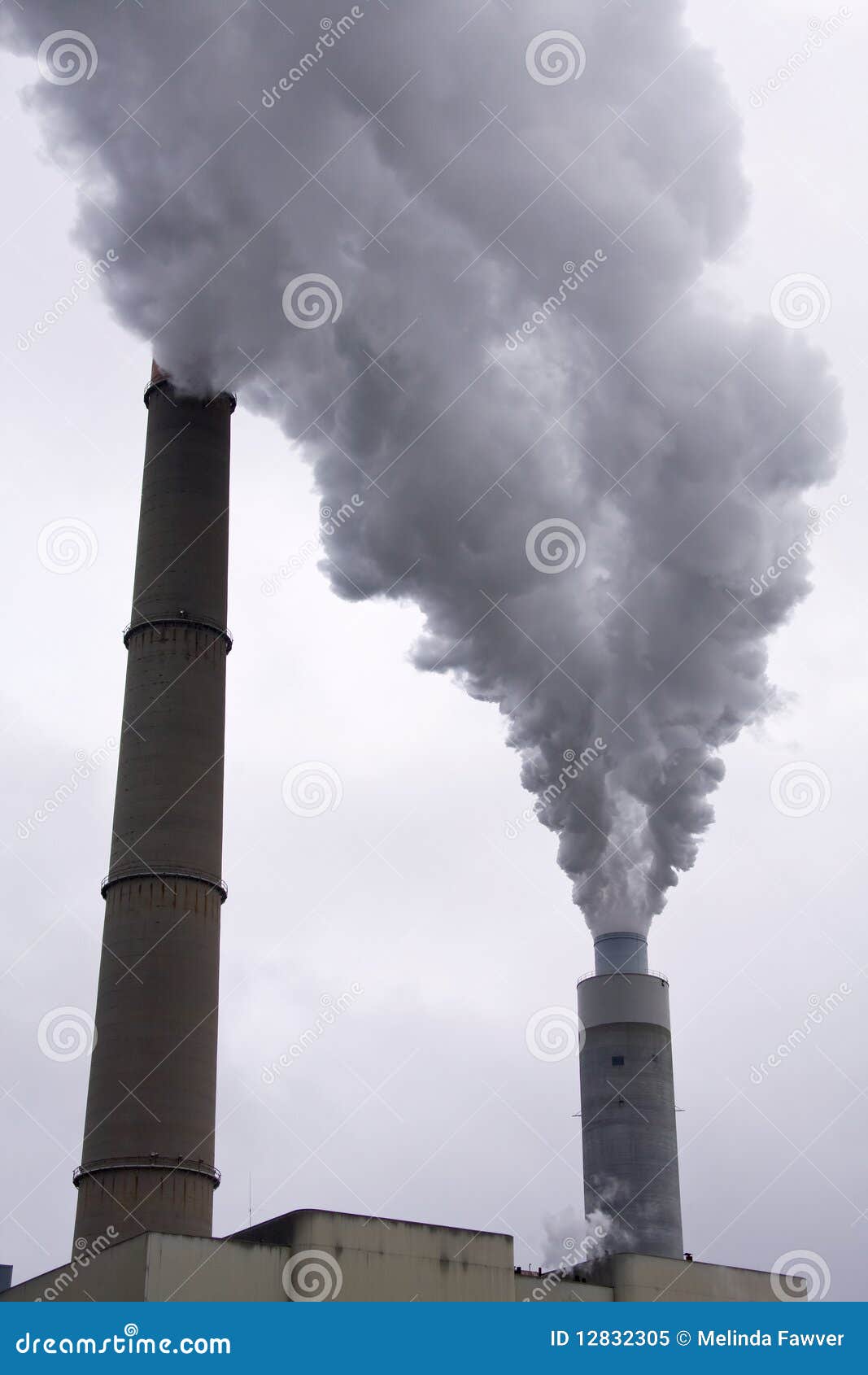 Factory With Smoke And Steam Coming Out Of The Chimneys Captured Behind ...
