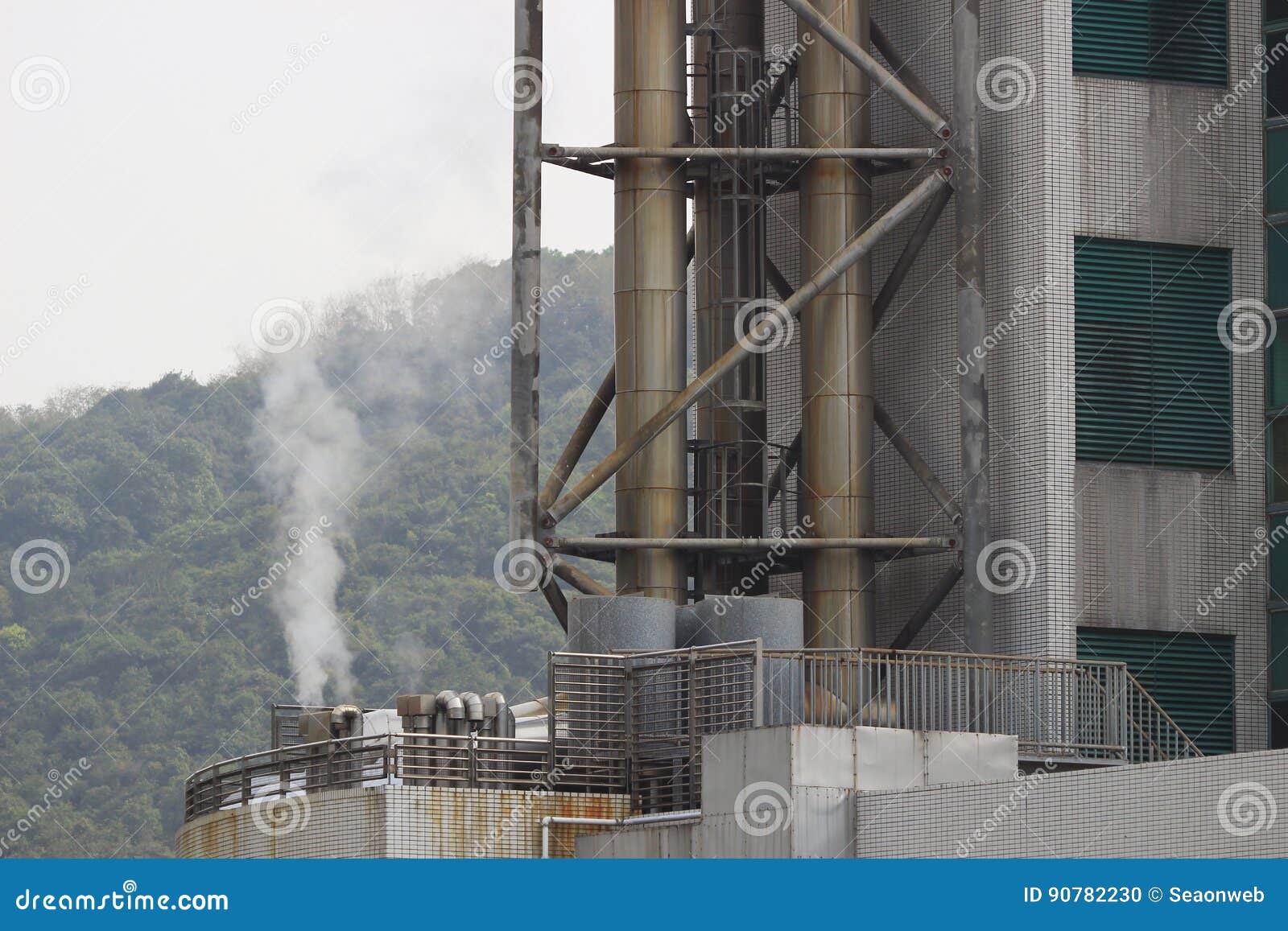 Factory with Smoke Stacks at Hk Stock Photo - Image of building, smoke ...