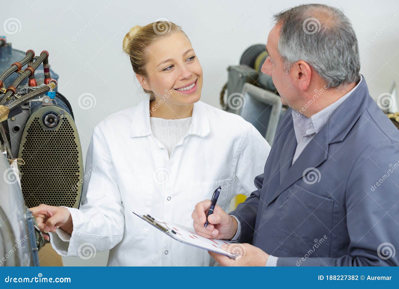 Factory Supervisor Giving Instructions To Female Apprentice Stock Photo ...