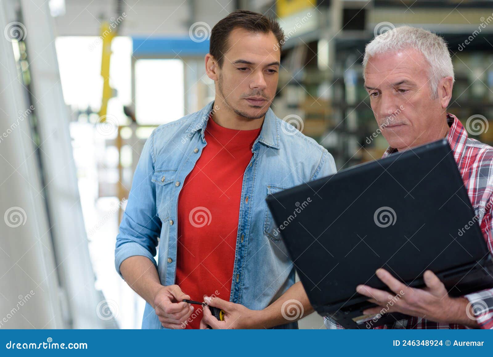 Factory Supervisor Showing Program in Laptop Stock Photo - Image of ...