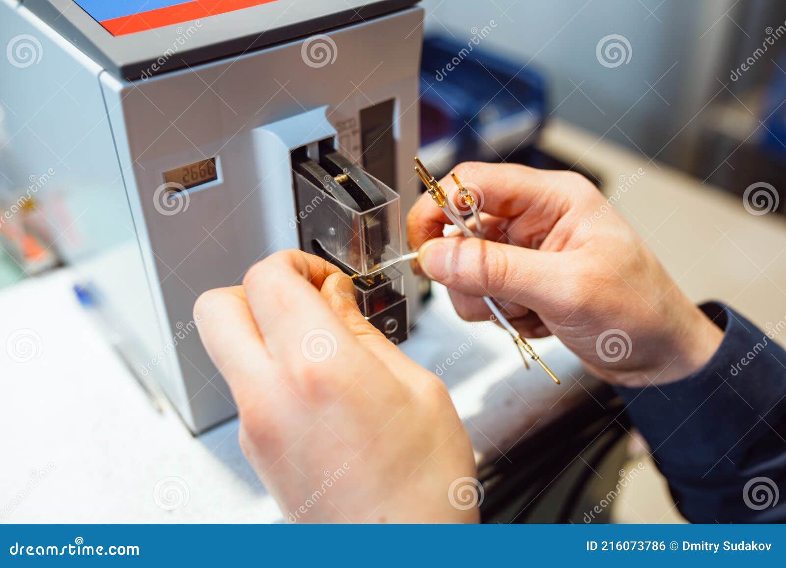 Factory Worker Assembles Cable Connections Using a Special Machine ...
