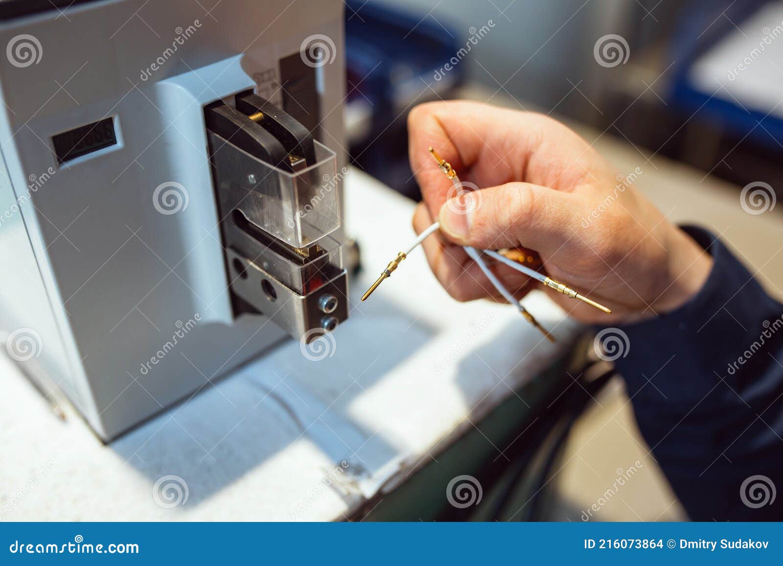 Factory Worker Assembles Cable Connections Using a Special Machine ...
