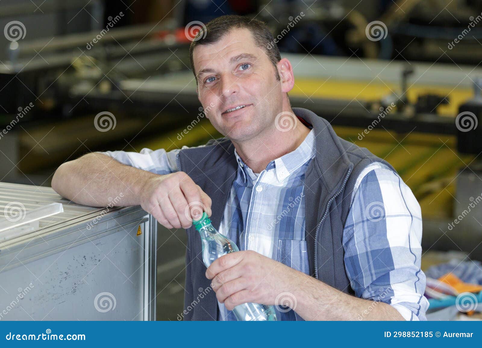 Factory Worker on Break Holding Bottle Water Stock Image - Image of ...