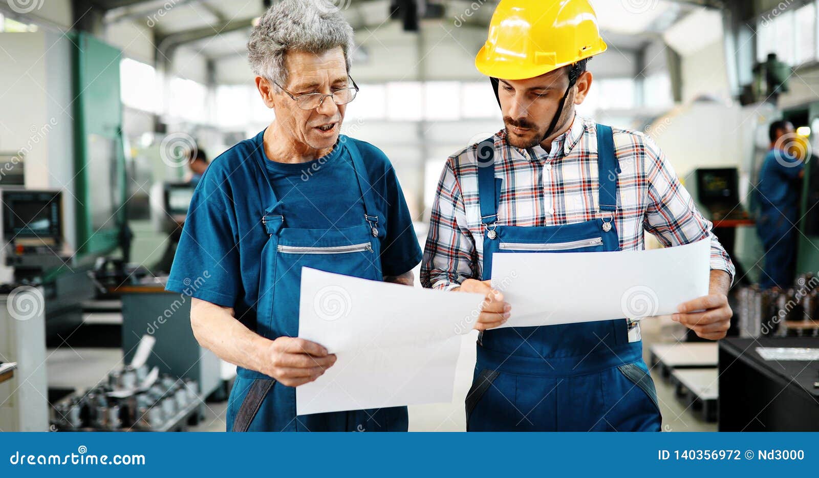 Factory Worker Discussing Data with Supervisor in Metal Factory Stock ...