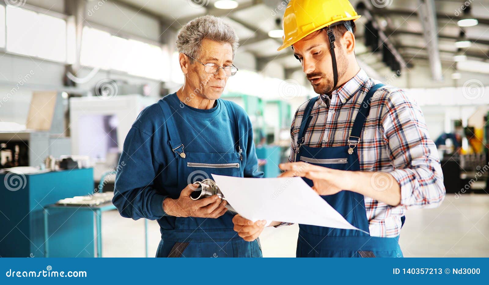 Factory Worker Discussing Data with Supervisor in Metal Factory Stock ...