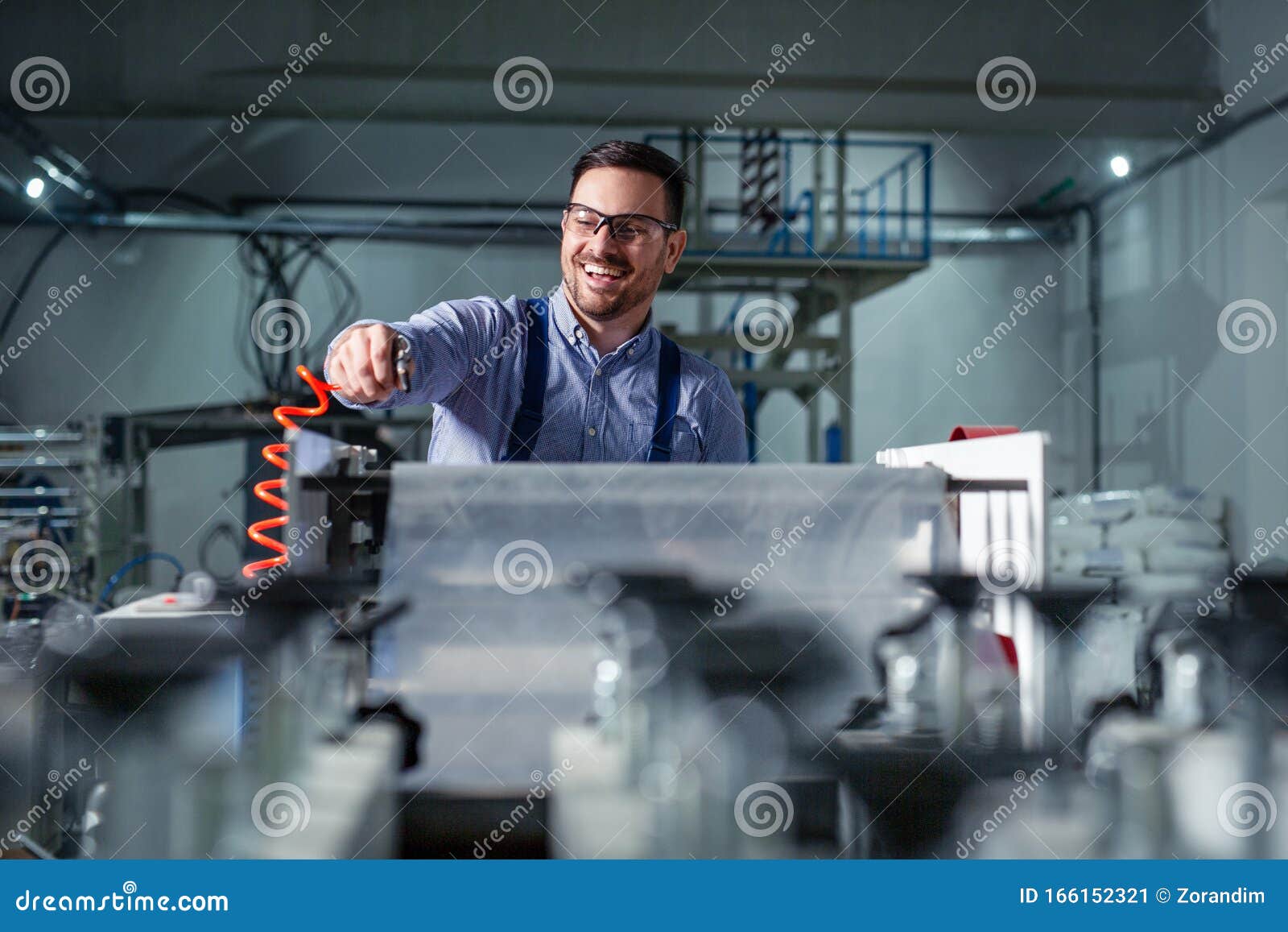 Factory Worker. Industrial Machine Operator Working in Factory Stock ...