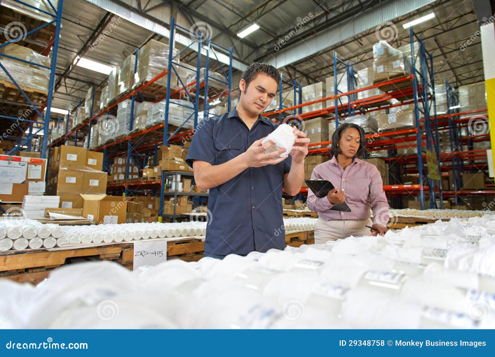 Factory Worker and Manager Checking Goods on Production Line Stock ...
