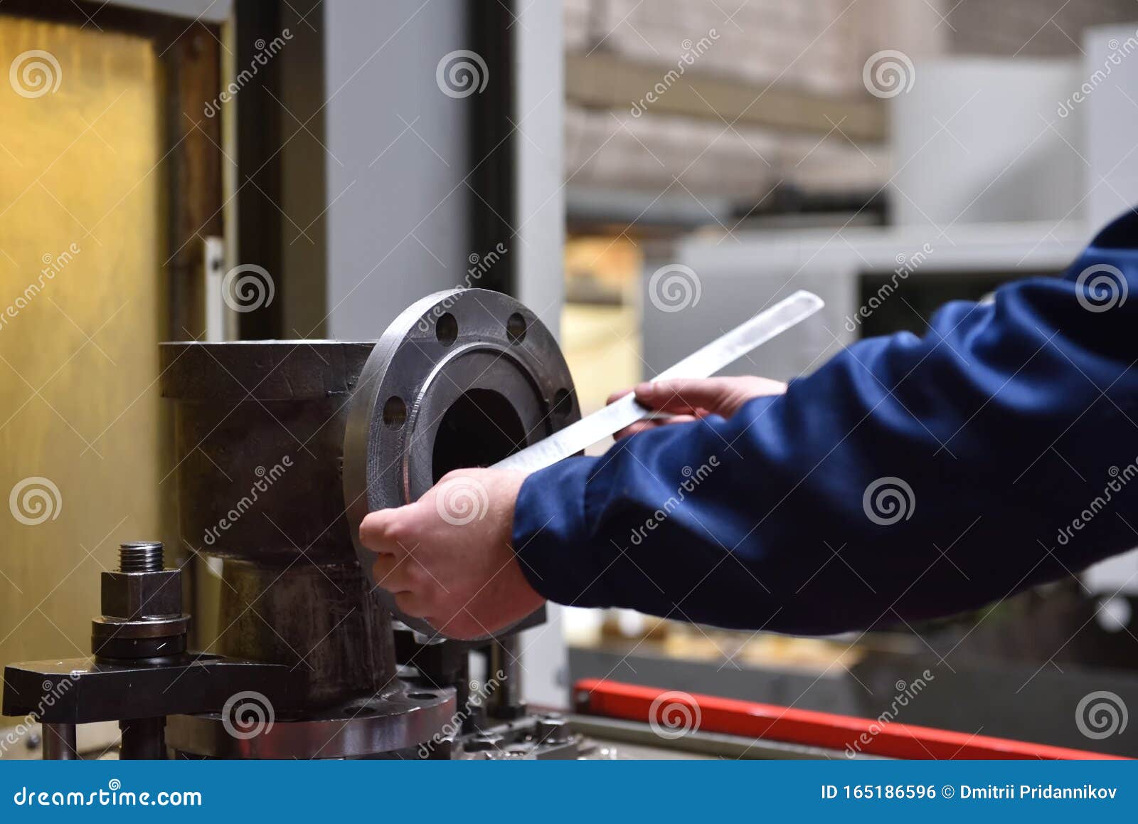 A Factory Worker Measures with a Ruler the Diameter of the Valve`s ...