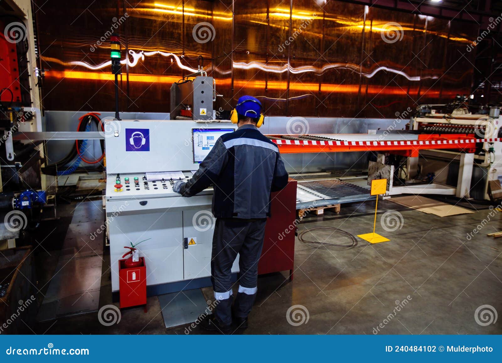 Factory Worker Operating CNC Machine in Metalworking Workshop Stock ...