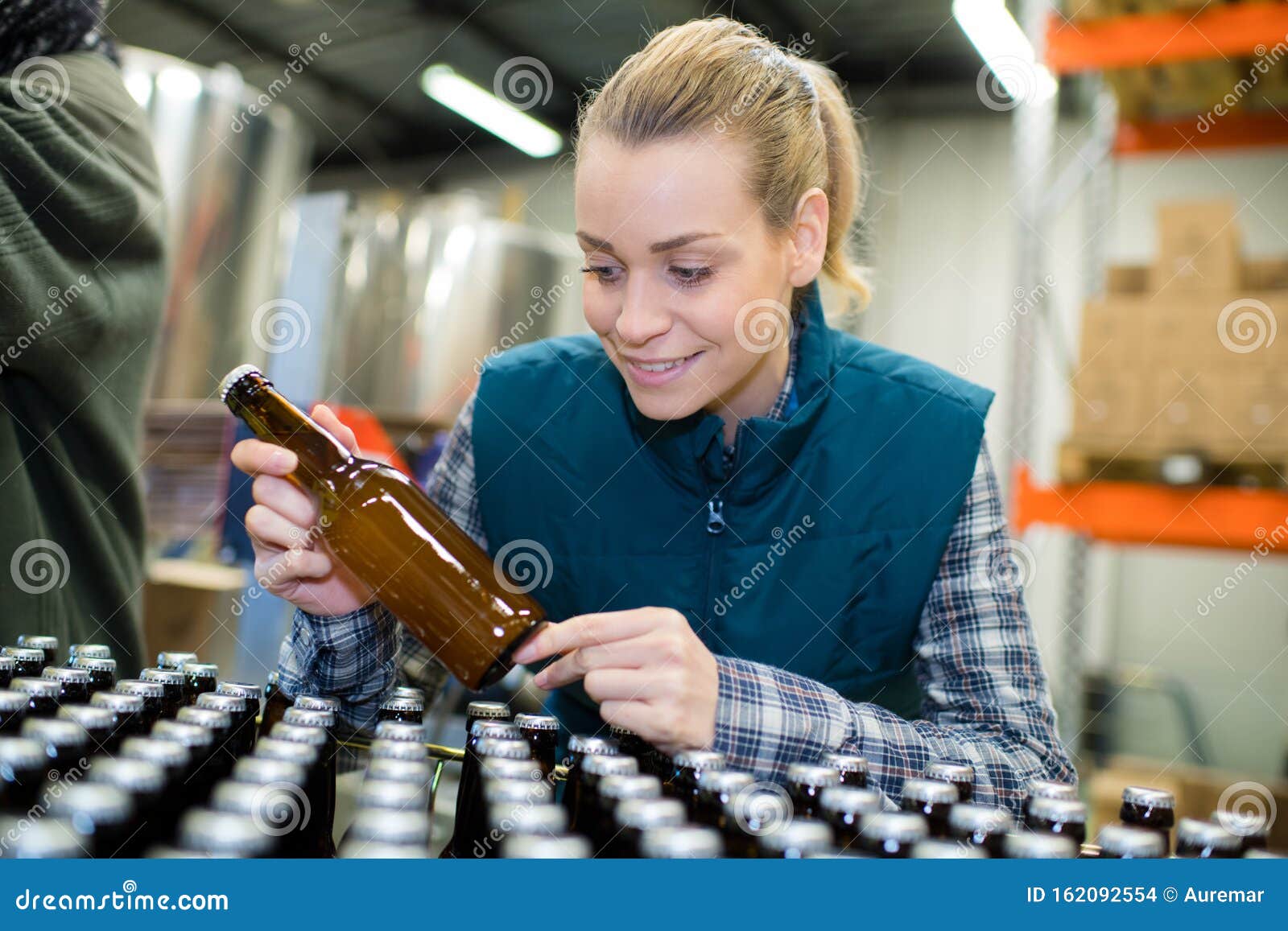 Factory Worker Operating Conveyor with Beer Bottles Stock Photo - Image ...