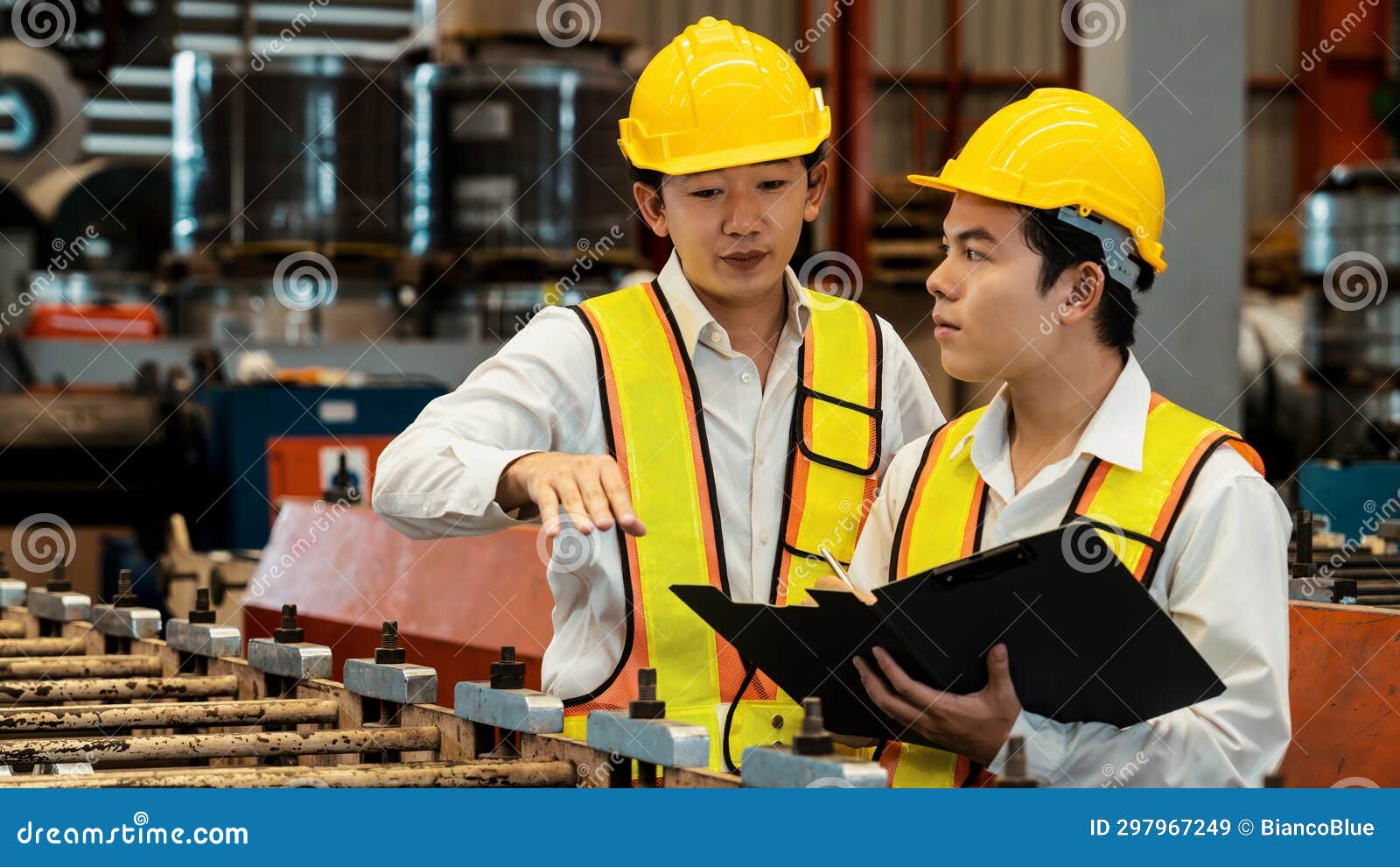 Factory Worker Operating Metal Stamping Machine with Engineer ...