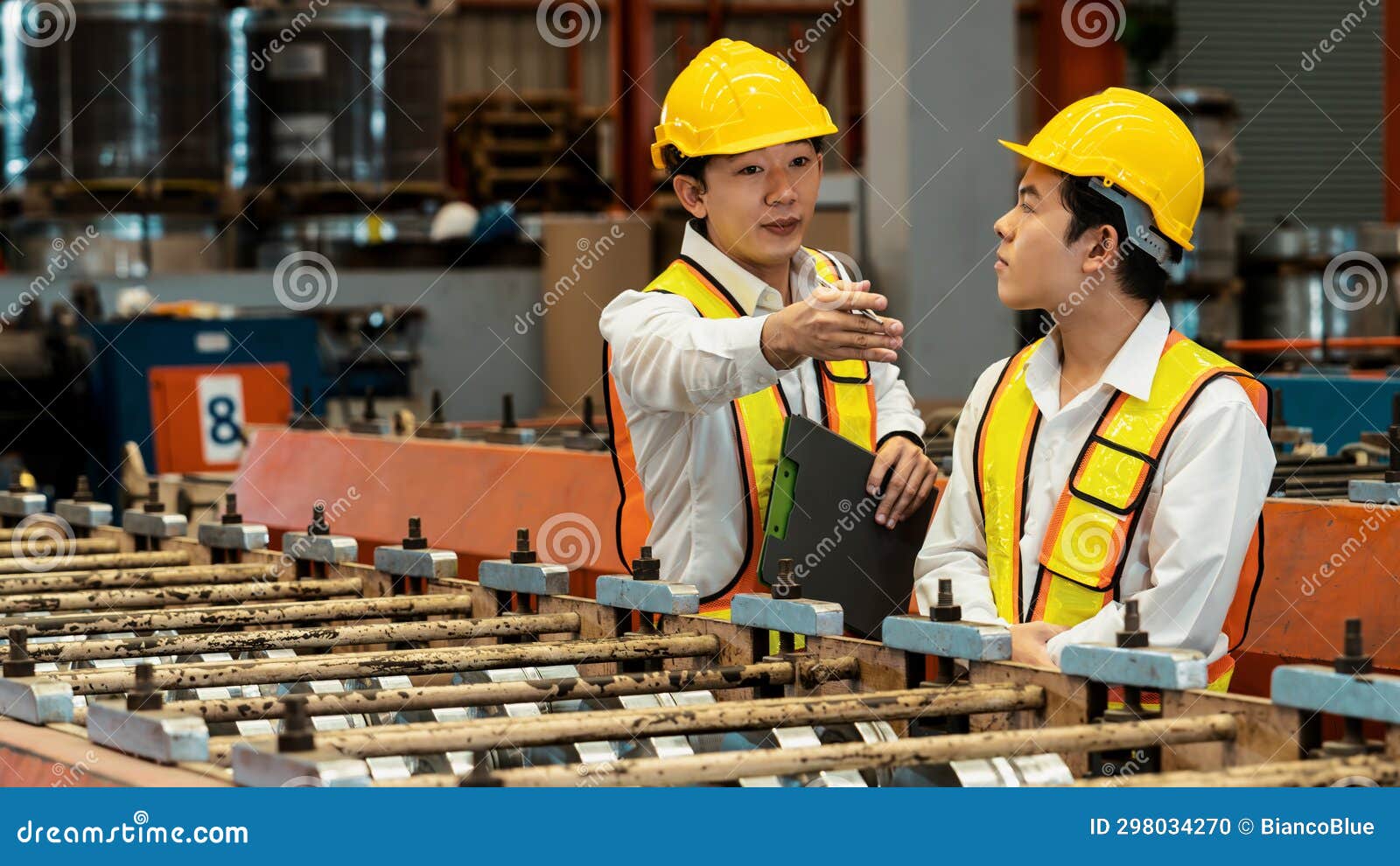 Factory Worker Operating Metal Stamping Machine with Engineer ...