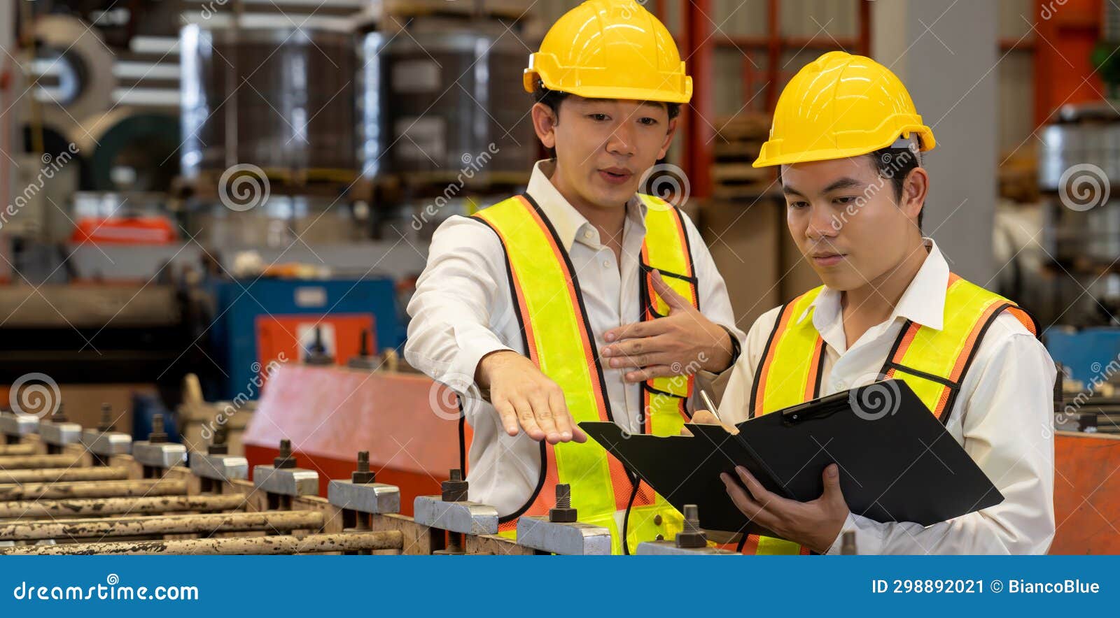 Factory Worker Operating Metal Stamping Machine with Engineer Pano ...