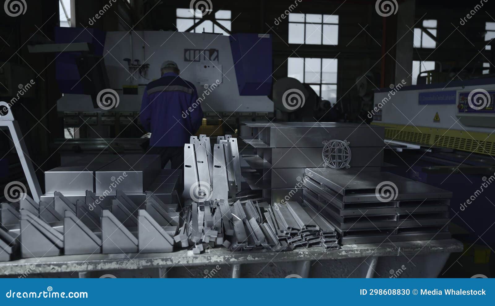 Factory Worker with Prefabricated Metal Parts. Creative. Metal Parts ...