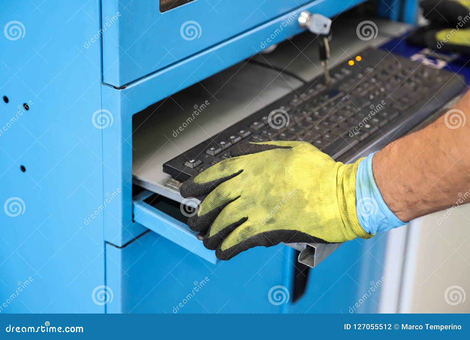 Factory Worker is Programming a CNC Milling Machine with a Tablet ...
