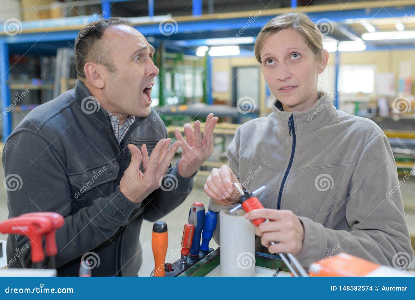 Factory Worker or Supervisor Shouting at Female Colleague Stock Photo ...