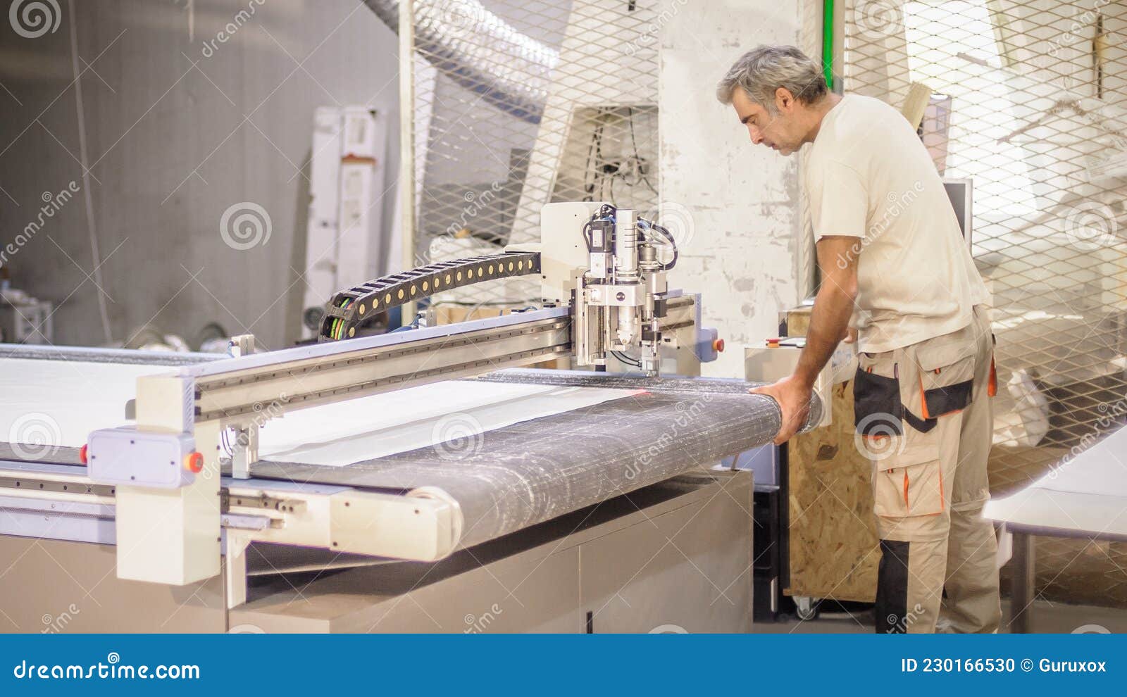 Technician Works on CNC Digital Cutter Machine for Cutting Textile ...