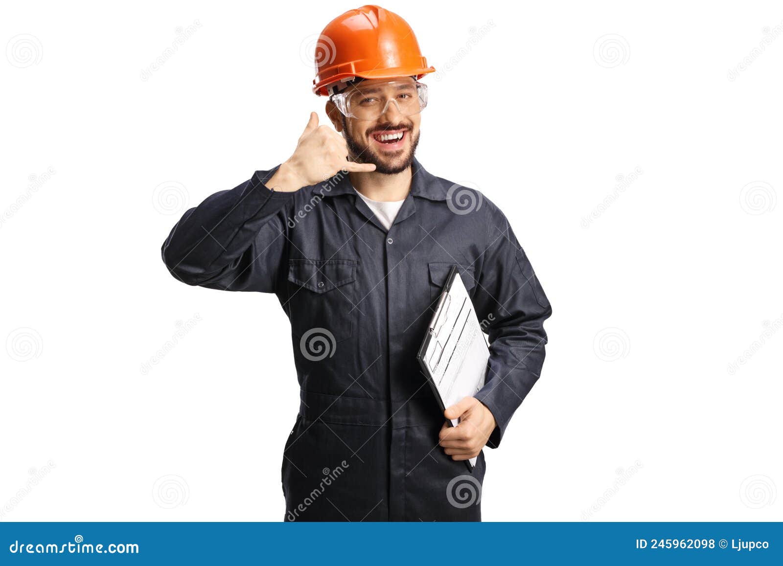 Factory Worker in a Uniform and Helmet Gesturing a Phone Call Sign ...