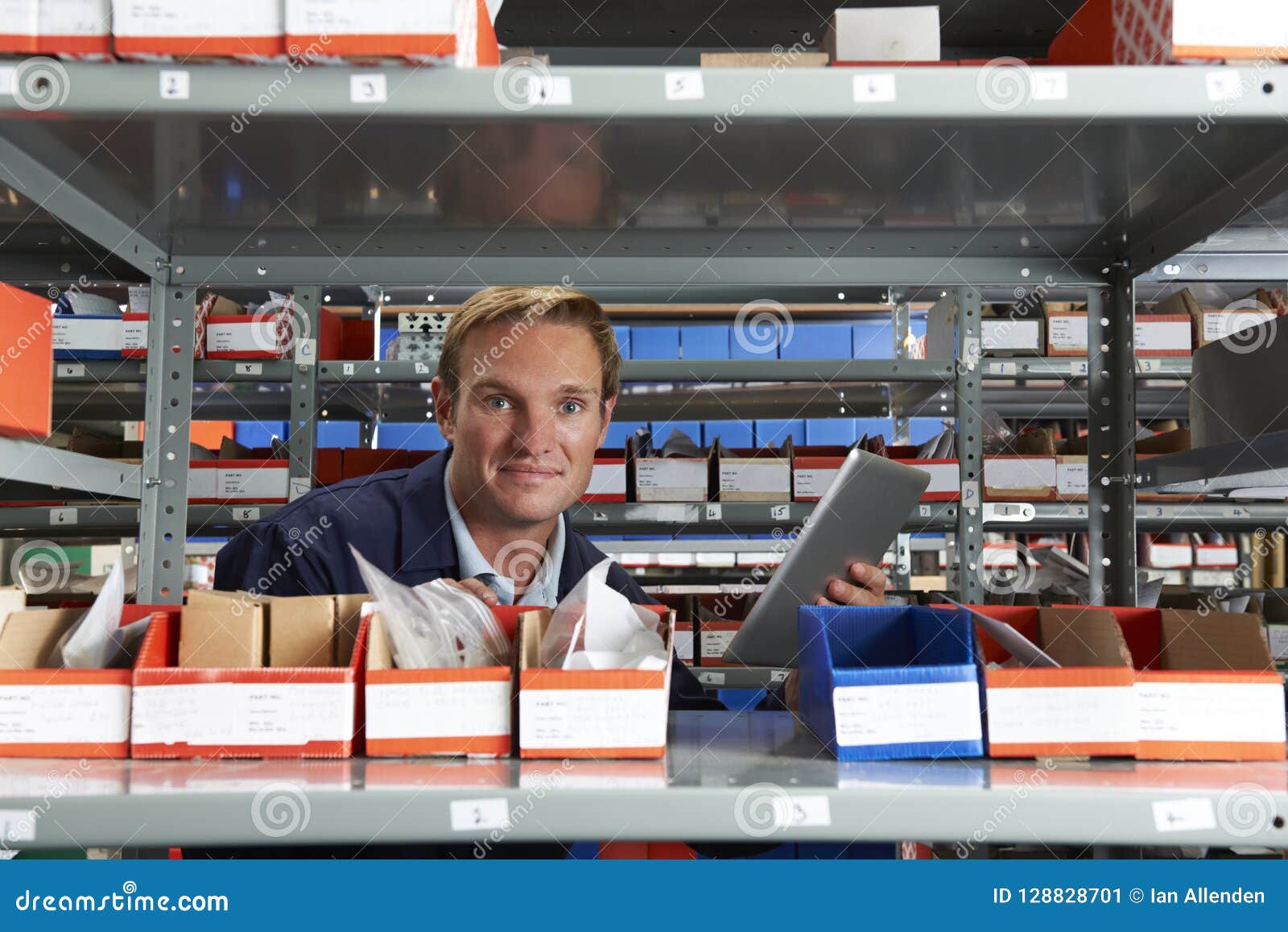 Portrait of Factory Worker Using Digital Tablet in Store Room Stock ...