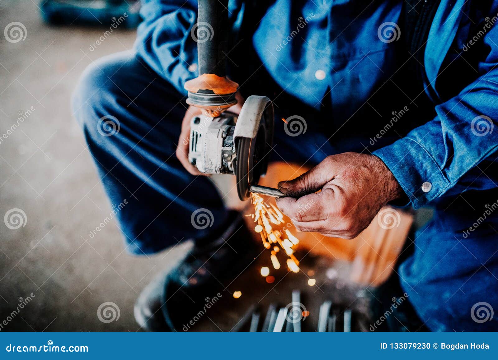 Factory Worker Working and Cutting Steel Iron with Angle Grinder Stock ...