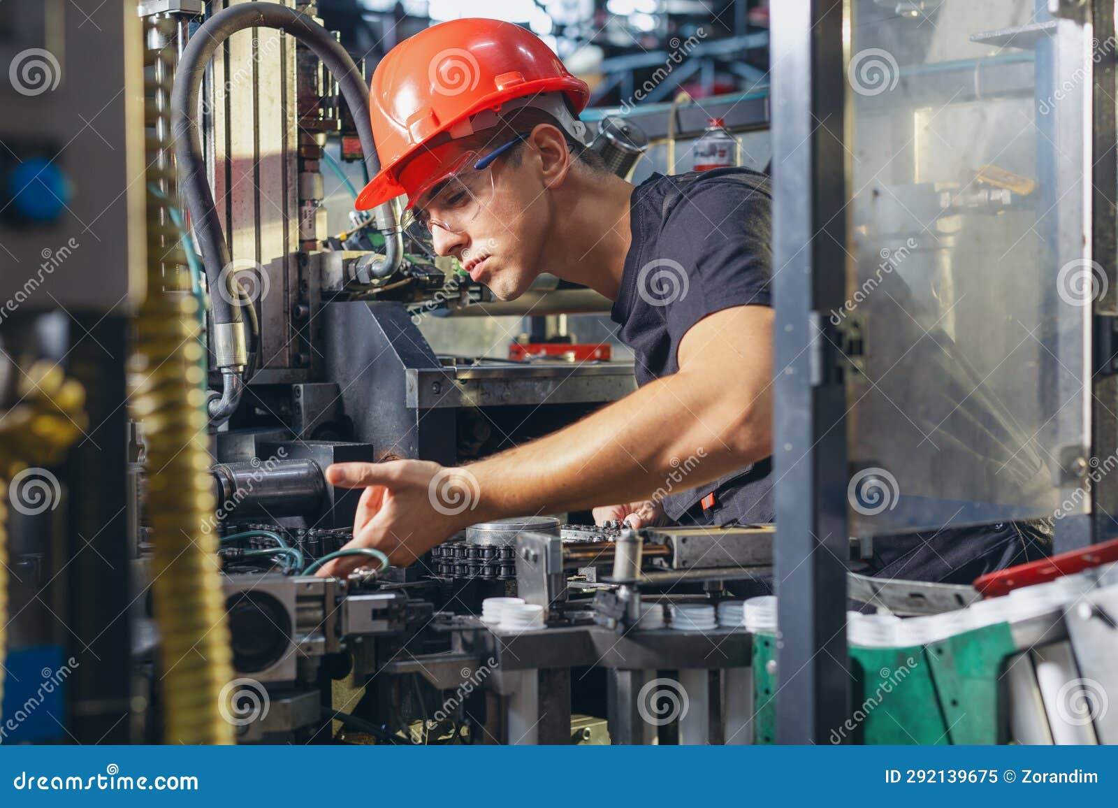 Factory Worker Working in Industrial Building Indoor. Man Fixing ...