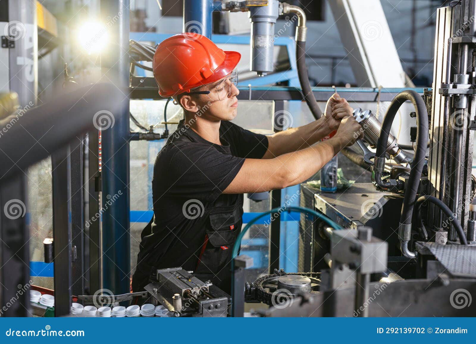 Factory Worker Working in Industrial Building Indoor. Man Fixing ...