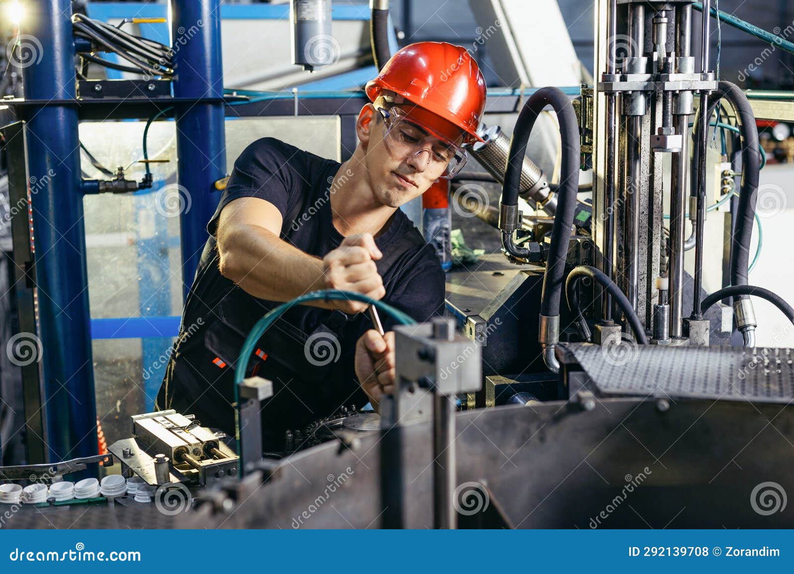 Factory Worker Working in Industrial Building Indoor. Man Fixing ...