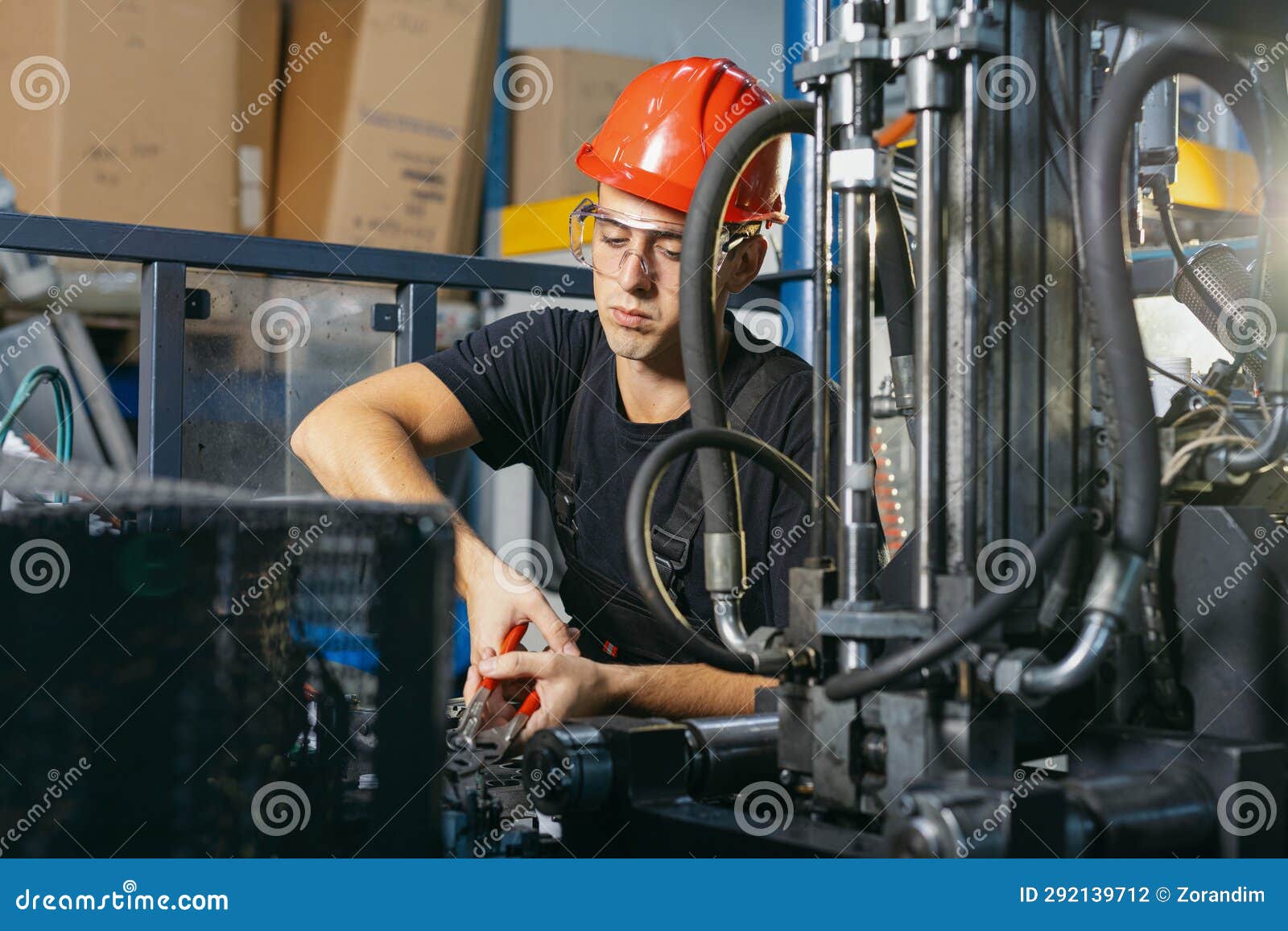 Factory Worker Working in Industrial Building Indoor. Man Fixing ...