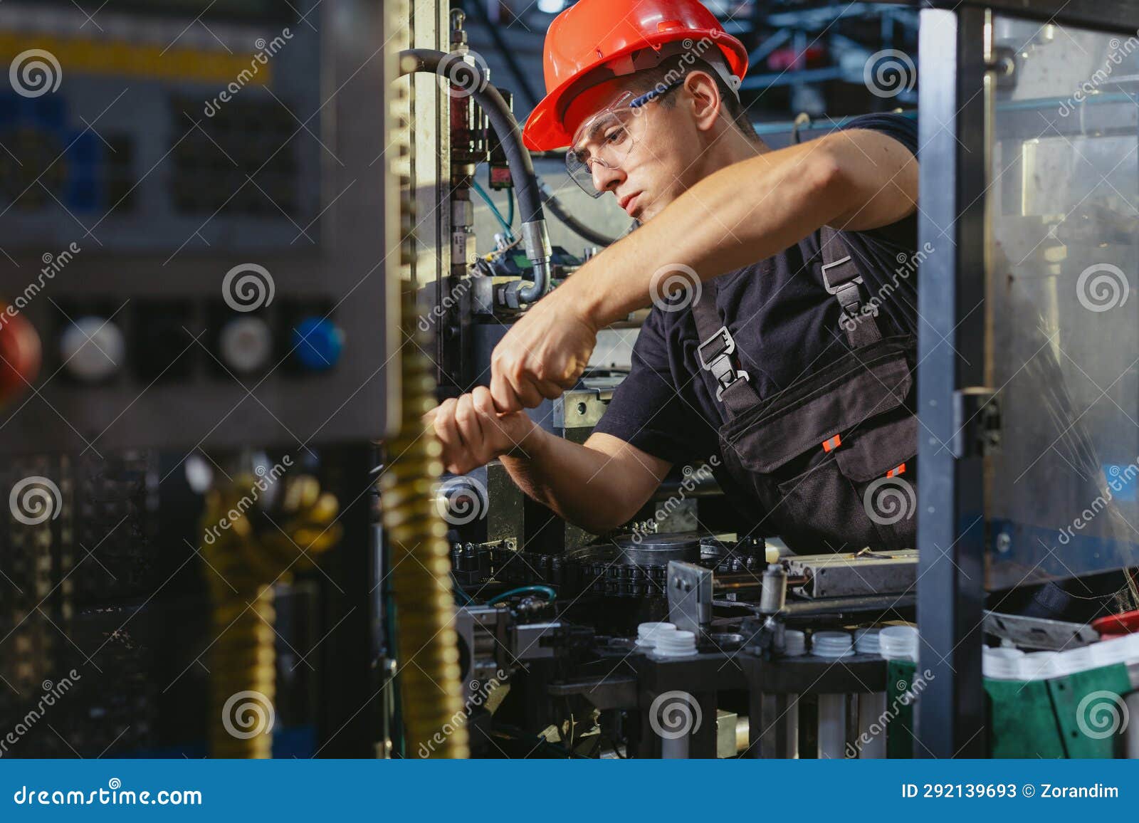 Factory Worker Working in Industrial Building Indoor. Man Fixing ...