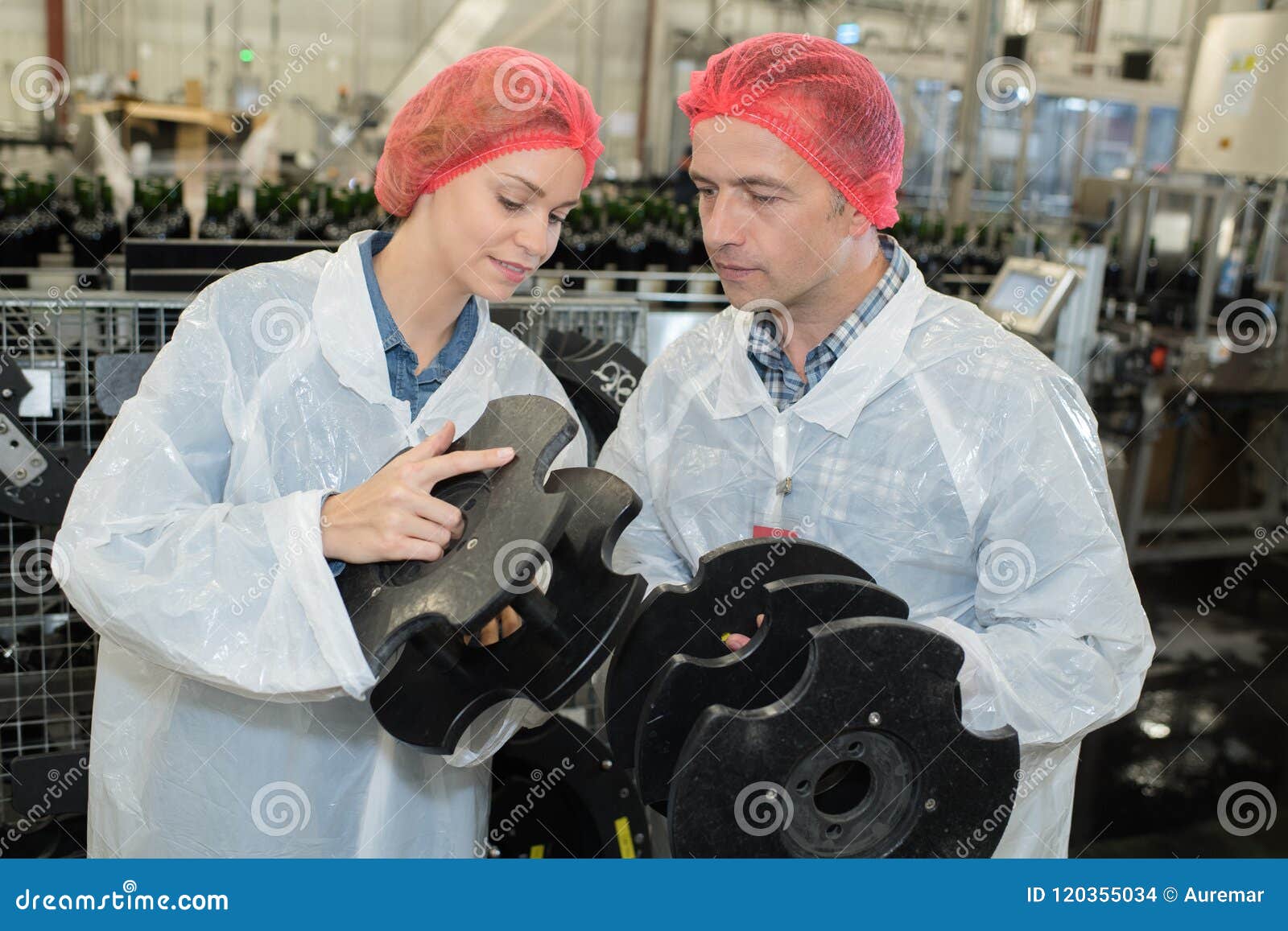 Factory Workers Checking Goods on Production Line Stock Photo - Image ...