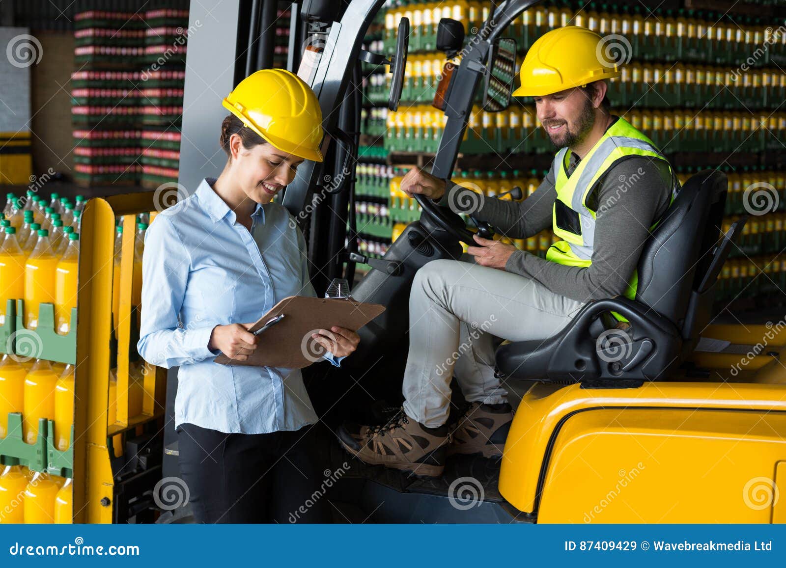 Factory Workers Checking Record on Clipboard in Factory Stock Image ...