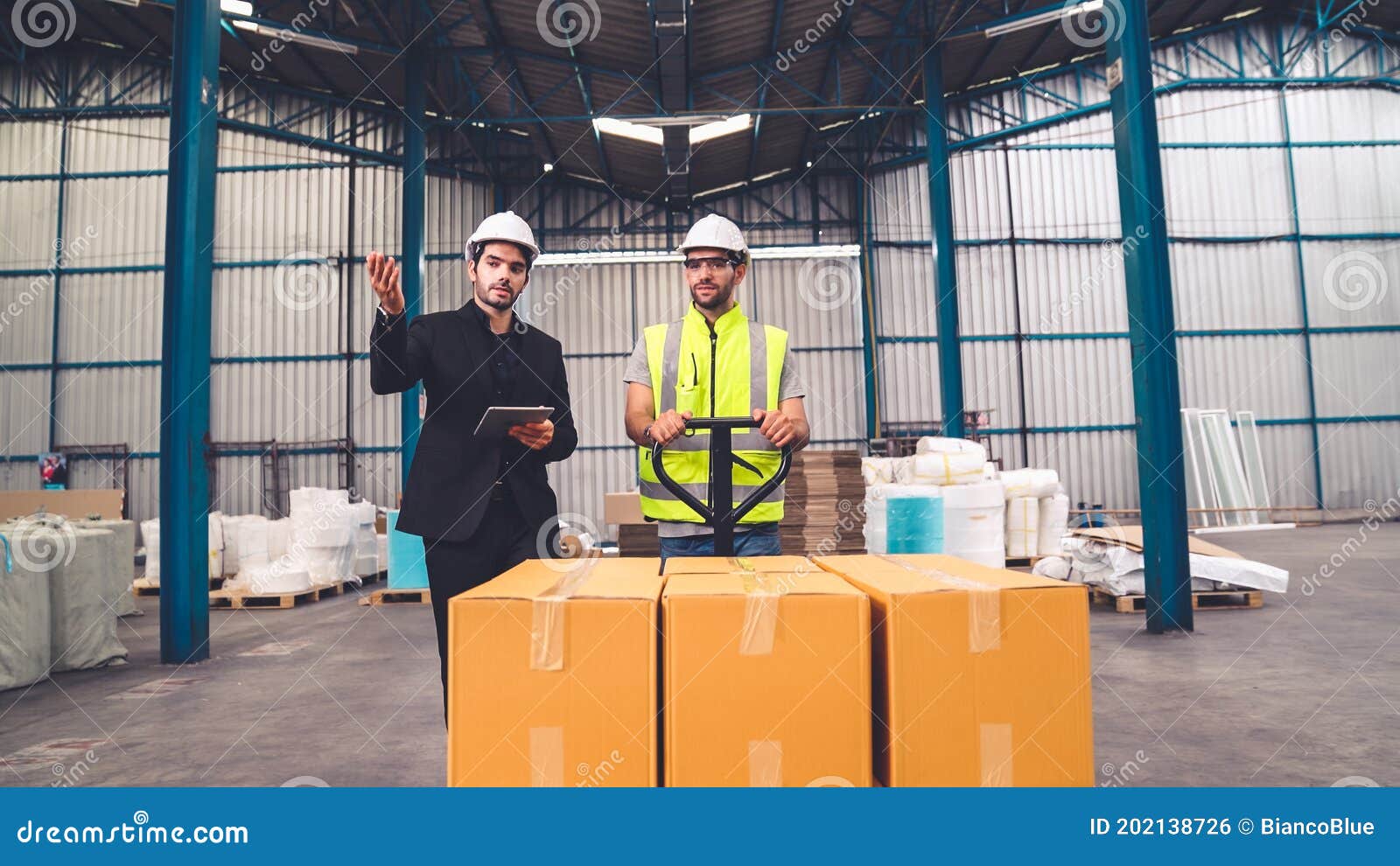 Factory Workers Deliver Boxes Package on a Pushing Trolley in the ...
