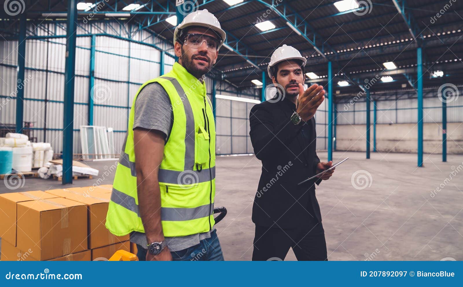 Factory Workers Deliver Boxes Package on a Pushing Trolley in the ...