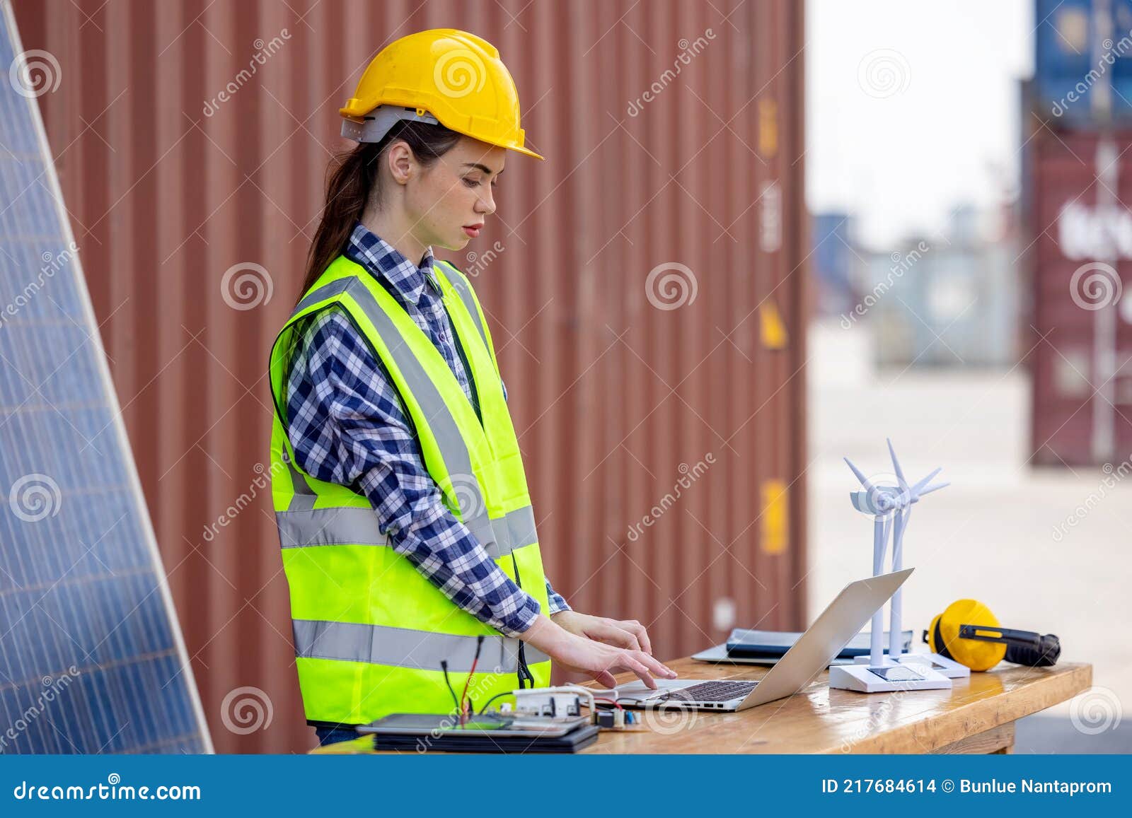 Factory Workers or Engineers Holding Light Bulb and Using Tablet ...