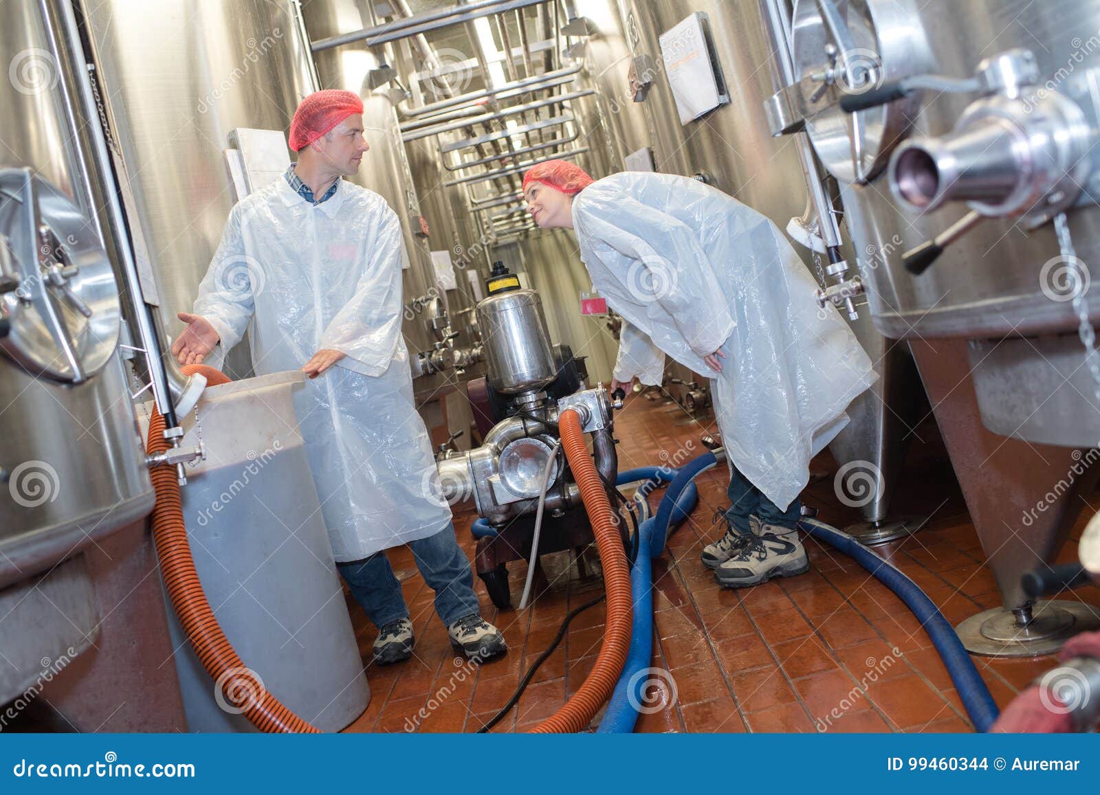 Factory Workers Holding Pipes in Factory Stock Photo - Image of fuel ... Factory Workers Holding Pipes in Factory Stock Photo - Image of fuel ...