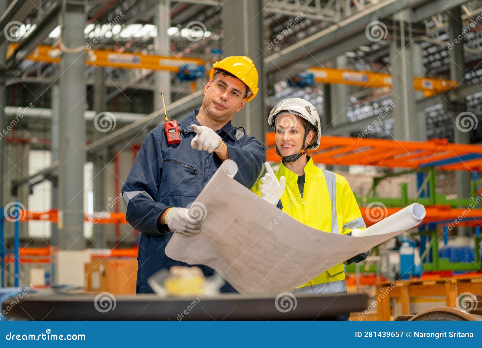 Factory Workers Man and Woman Discuss about the Project Using Drawing ...