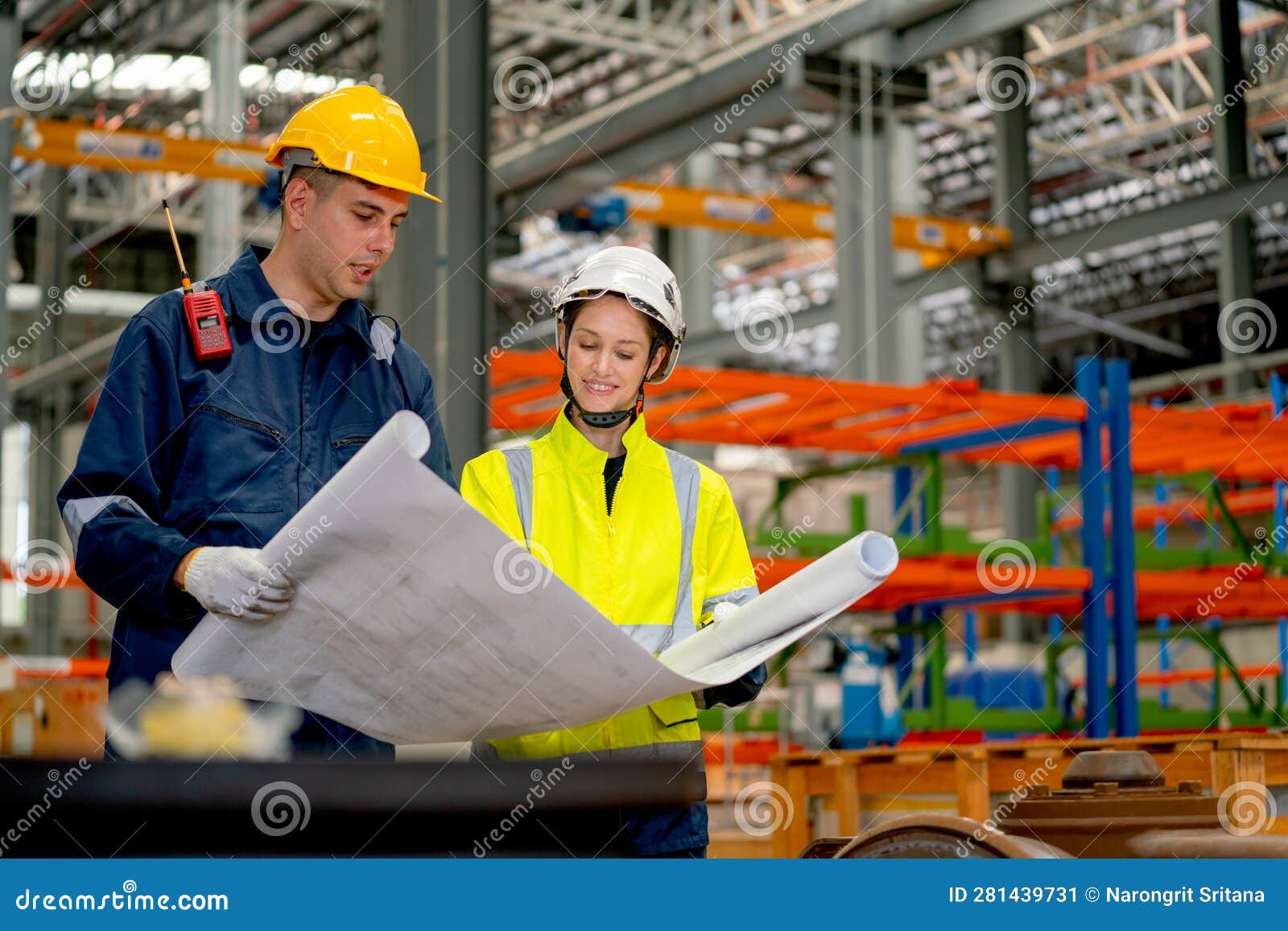 Factory Workers Man and Woman Discuss about the Project Using Drawing ...