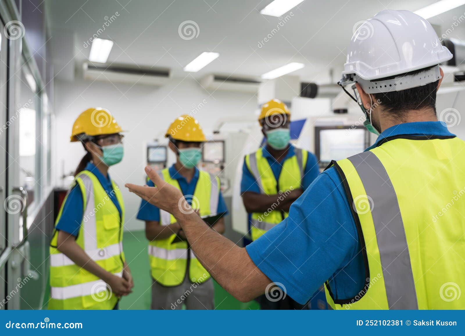 Factory Workers Meeting before Work and Put on a Mask. Stock Image ...