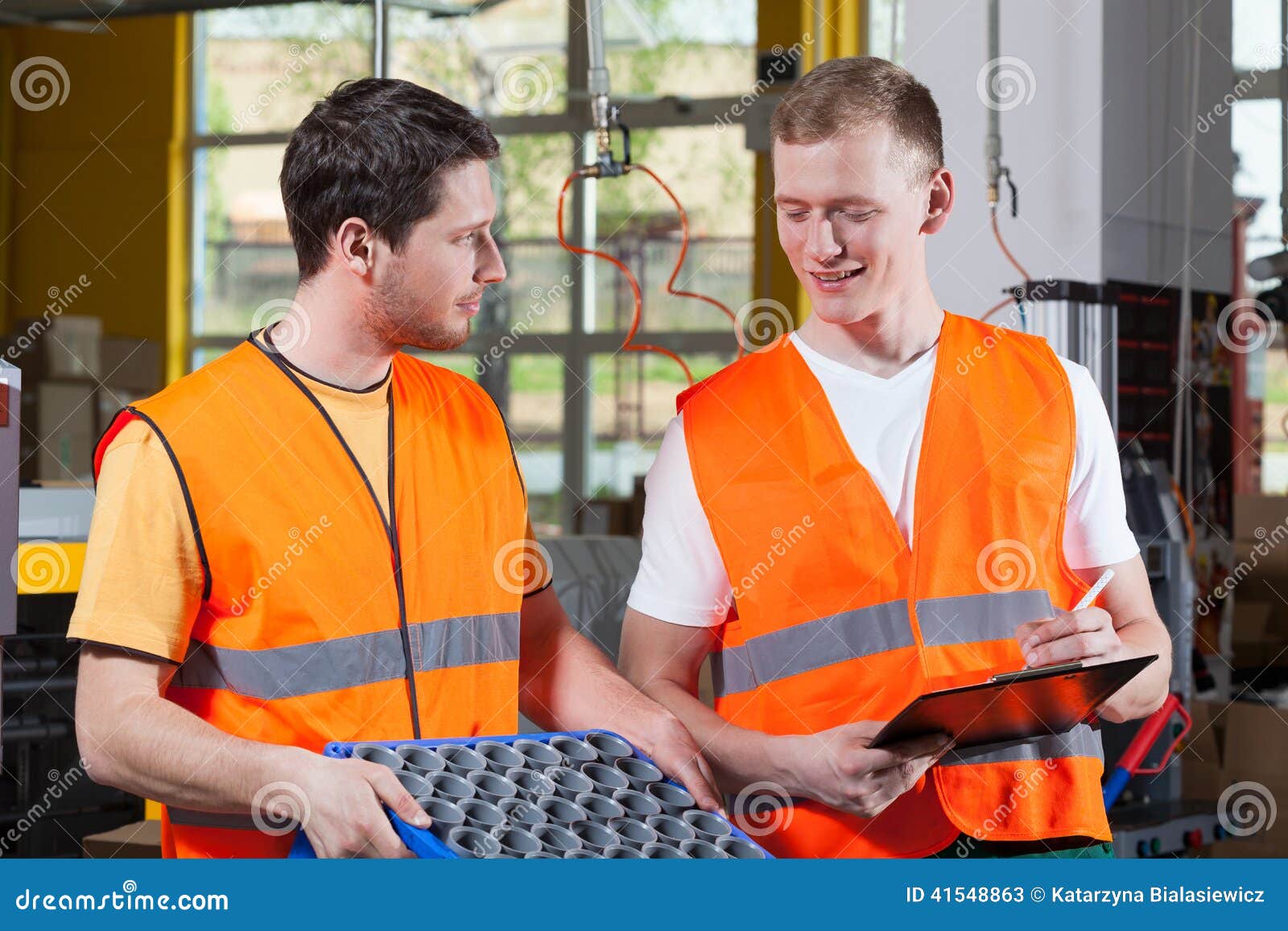 Workers In Orange Uniform Are Laying Hot Asphalt On A City Street. Road ...