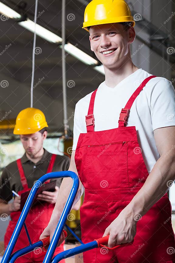 Factory Workers Pushing a Manual Trolley Stock Photo - Image of adult ...