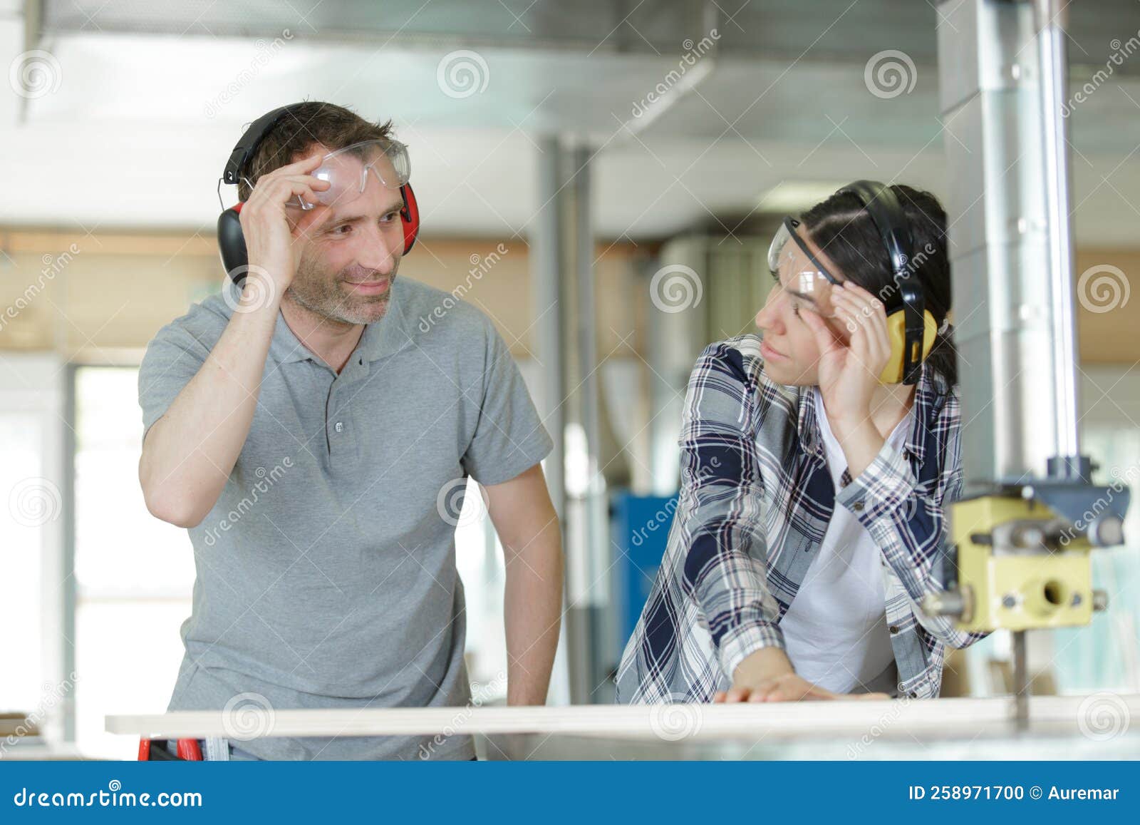 Factory Workers Raising Their Goggles Stock Photo - Image of female ...